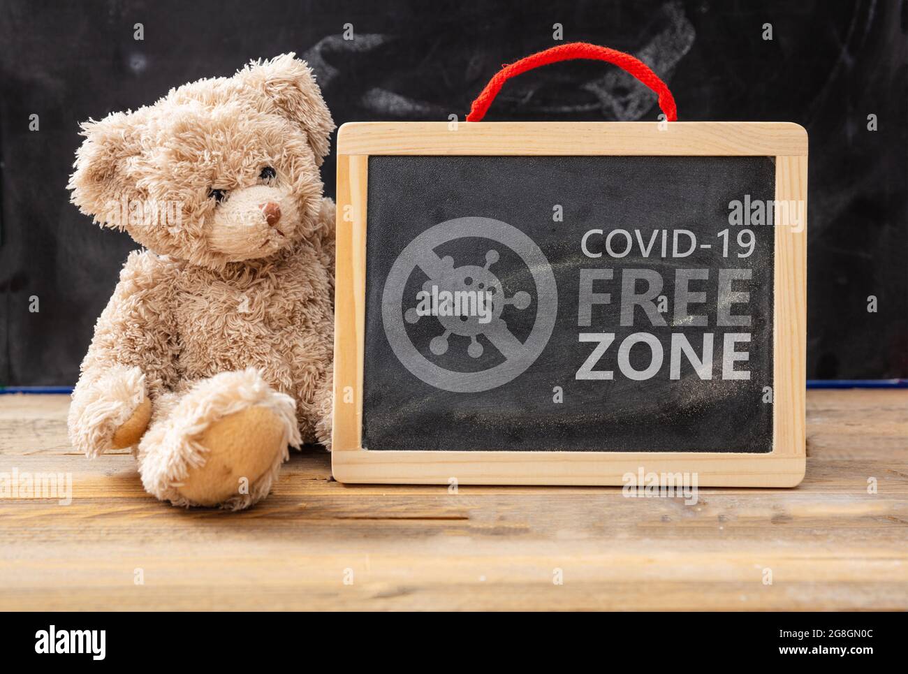 Covid free zone sign. COVID 19 FREE ZONE text on a blackboard and a ...