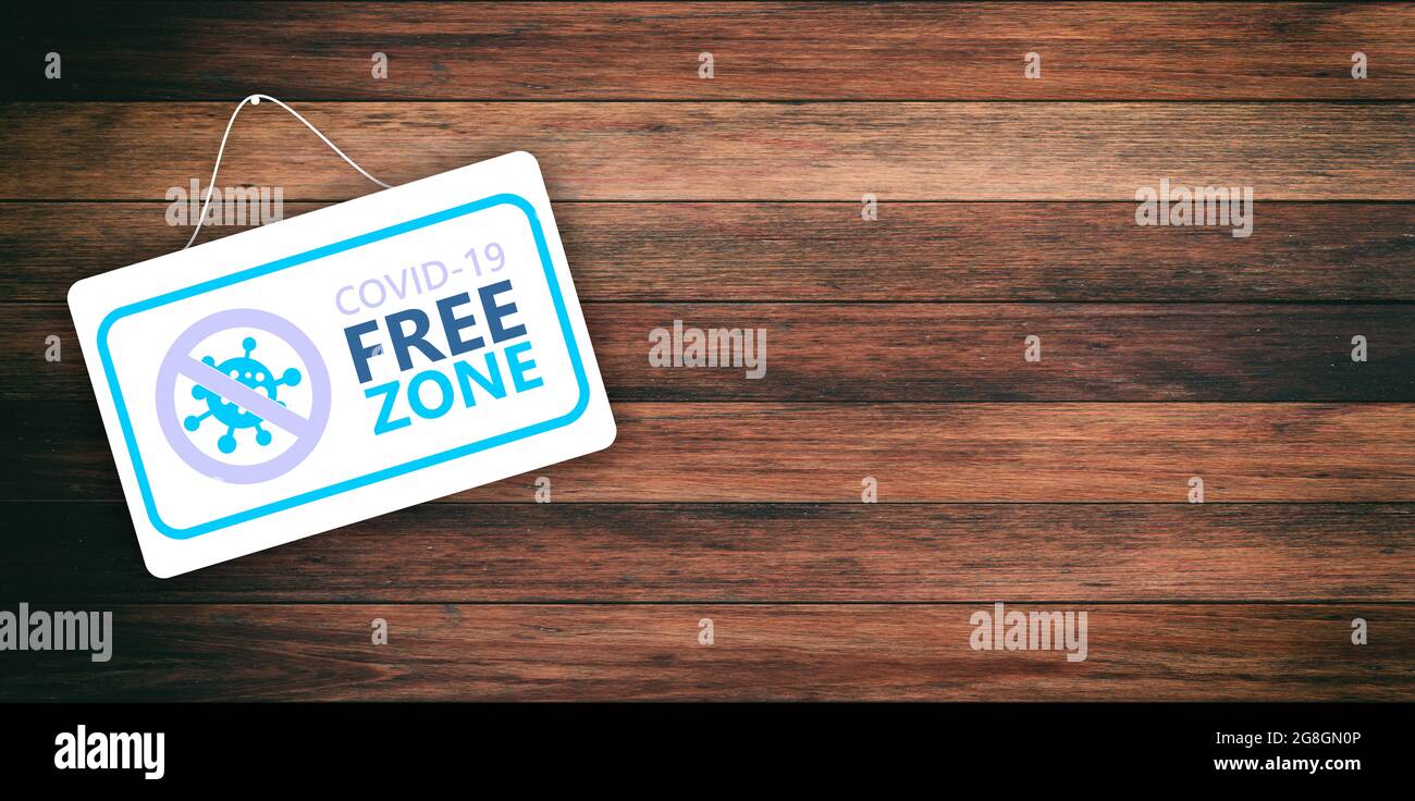 Covid free zone sign. COVID 19 FREE ZONE text label hanging, wooden ...