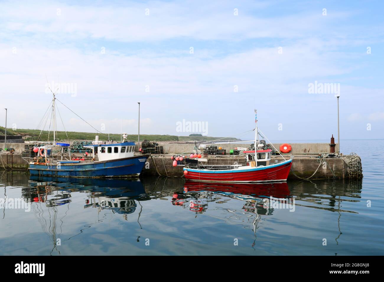 Fishing vessels in a small harbour in northern Scotland Stock Photo - Alamy