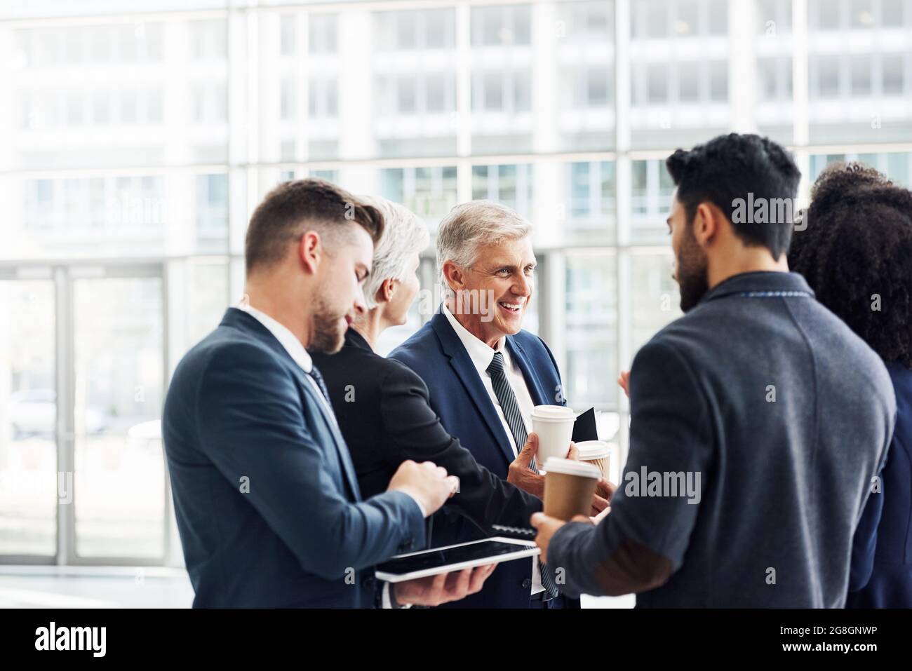 Having a quick coffee before going into the meeting Stock Photo - Alamy
