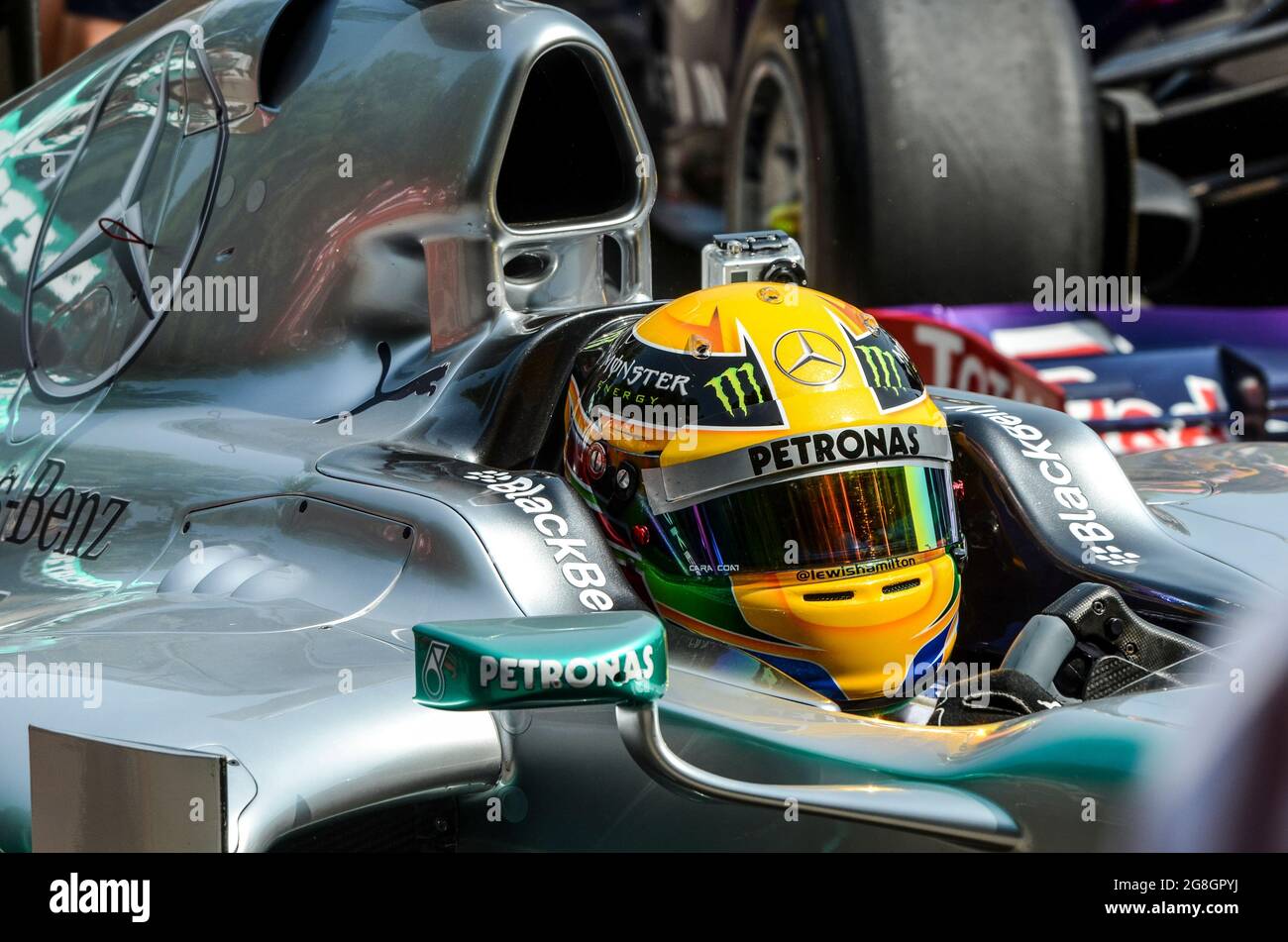 Lewis Hamilton (behind visor) in the cockpit of a Mercedes Formula 1 ...
