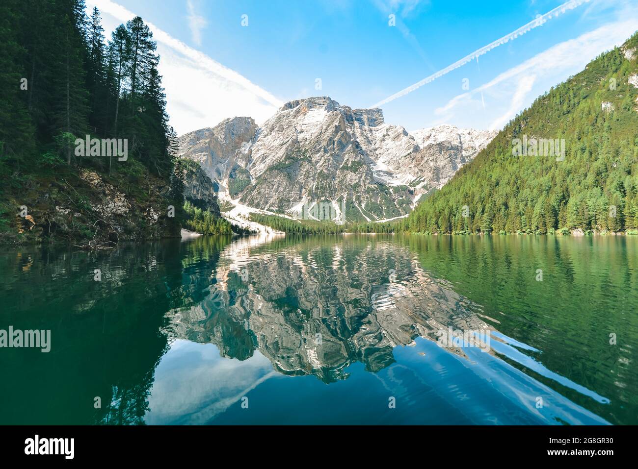 landscape view of alpine lake summer time. reflection in water surface ...