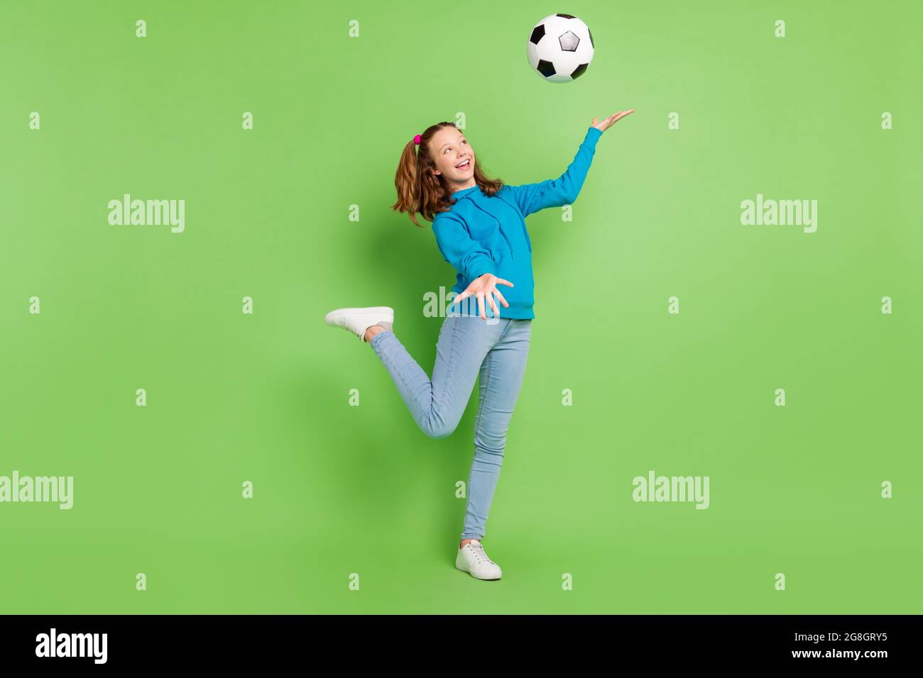 Full body photo of charming happy positive small girl catch football ...