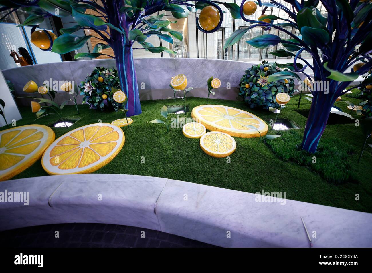 Fabricated lemon tree sculptures span the majority of a pedestrian ...