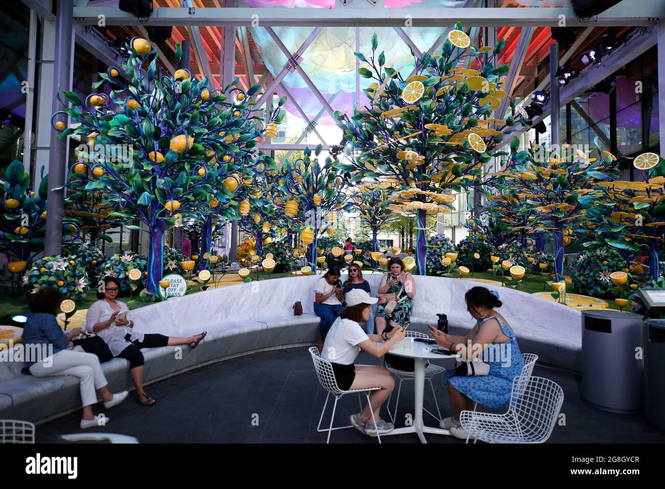 People enjoy the fabricated lemon tree sculptures that span the ...