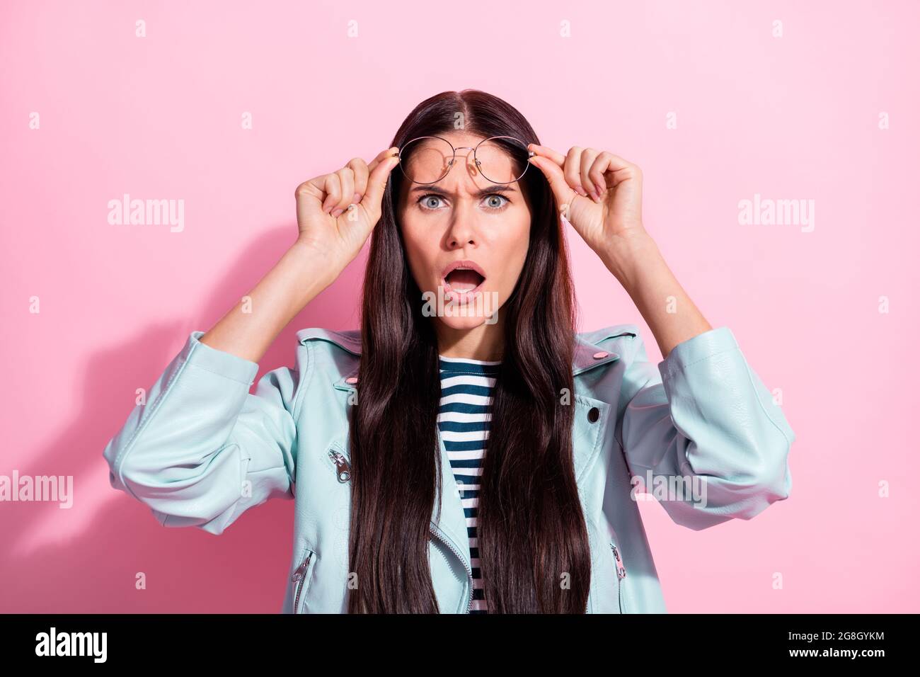 Photo of unhappy amazed young brunette woman raise glasses fake news ...
