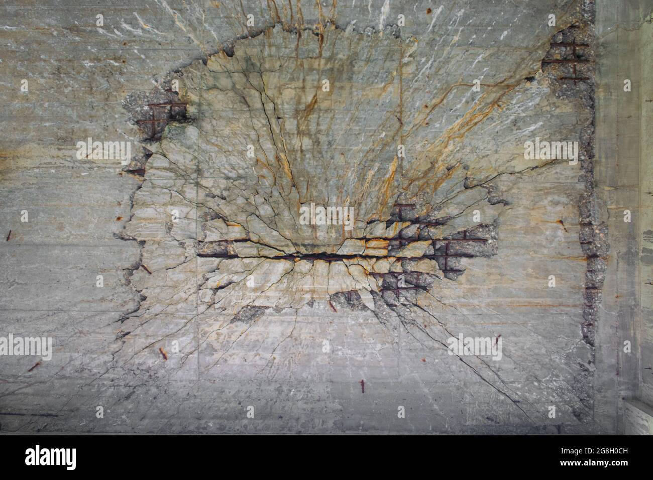 Crack in a concrete massive crack. Something exploded on the other side ...