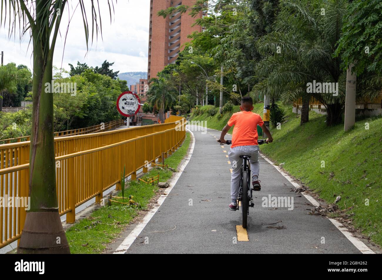 latin boy riding bicycle Stock Photo - Alamy