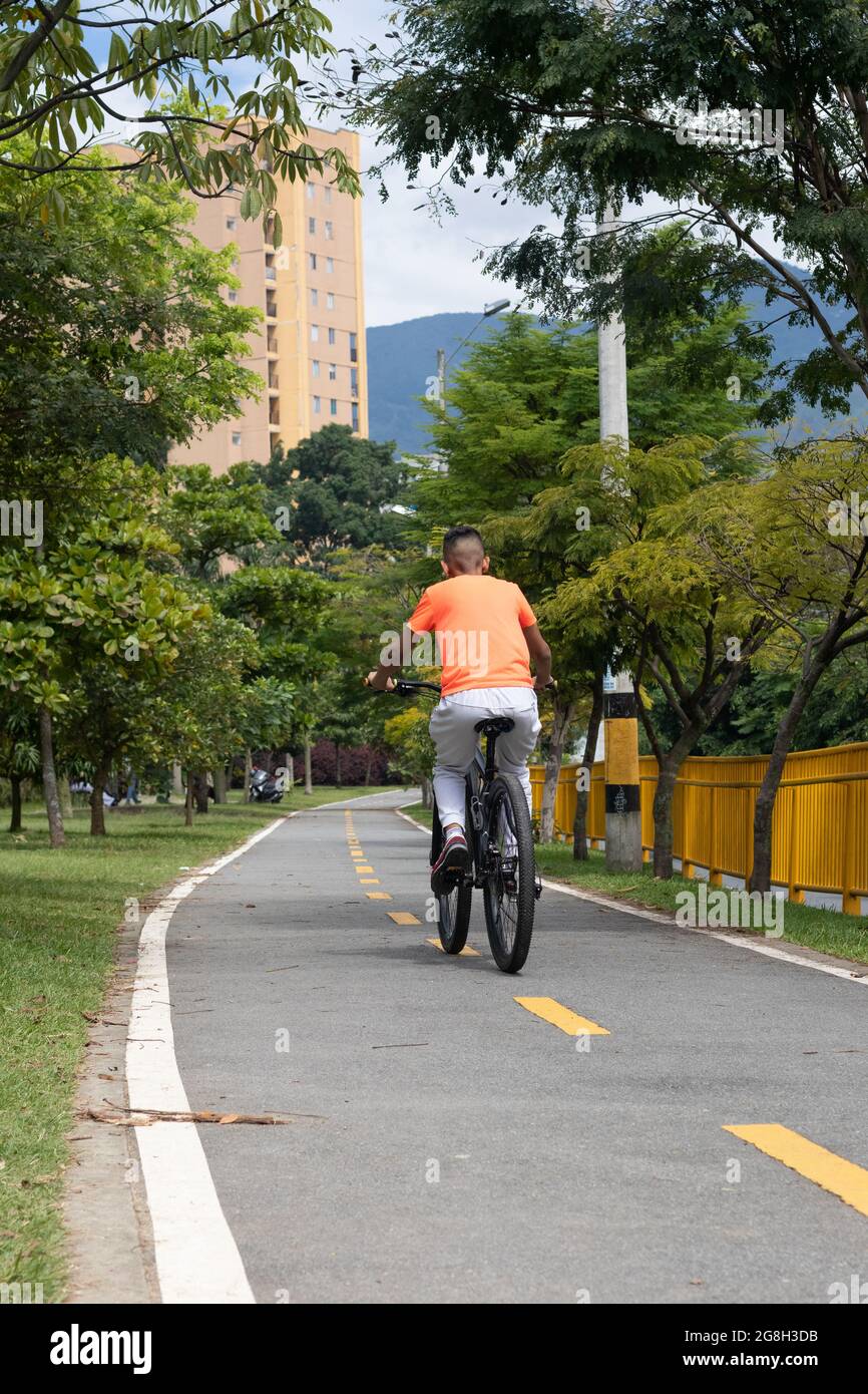 latin boy riding bicycle Stock Photo - Alamy