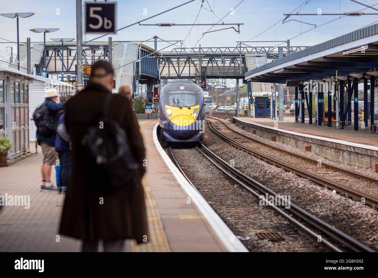 Passengers and a high speed Southeastern train at Ashford International ...