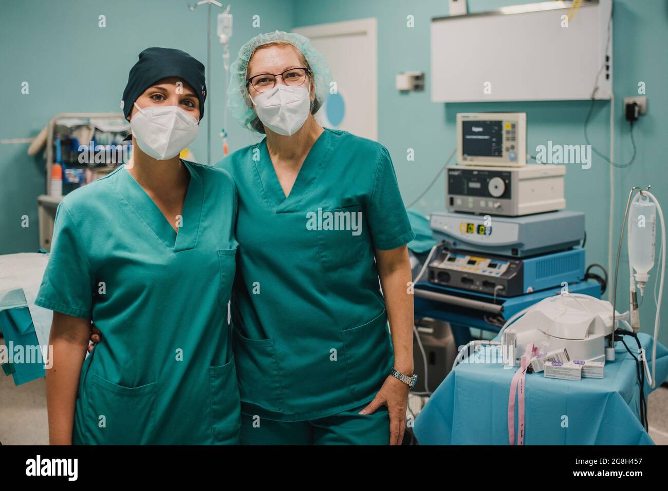 Portrait of medical nurses looking at camera inside operating theater ...