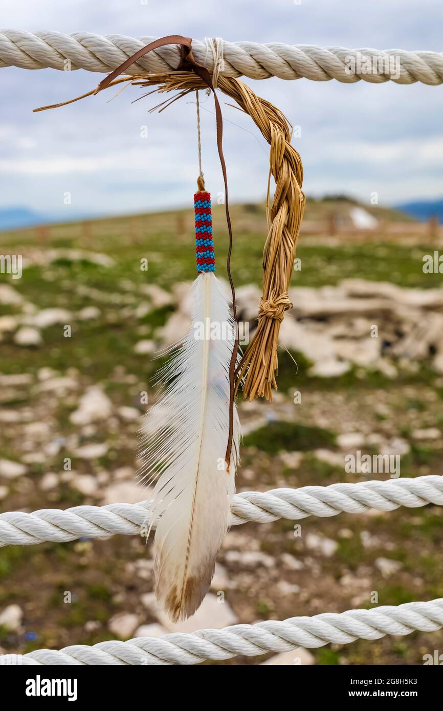 Prayer offering of feather and braided grass left by Native Americans ...