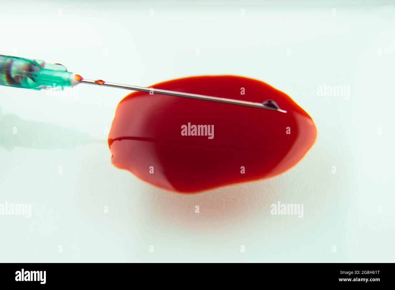 Syringe and bloody hypodermic needle sample of blood smeared Stock ...