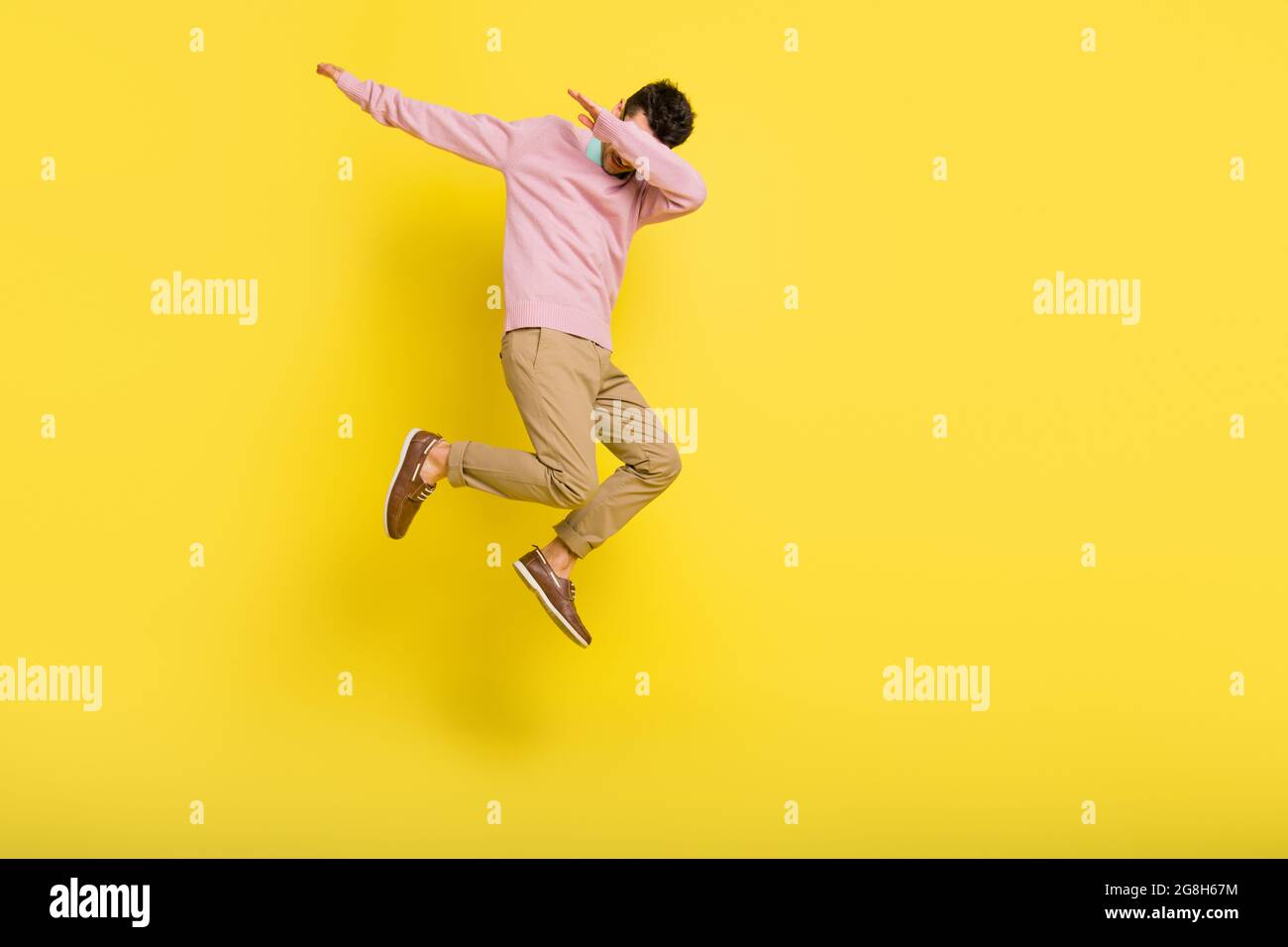 Full size photo of young funky funny man jumping showing dab cover ...