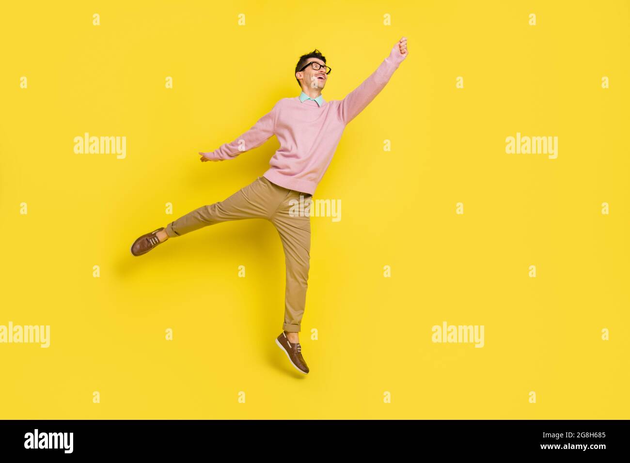 Full length photo of young excited man happy positive smile jump up try ...