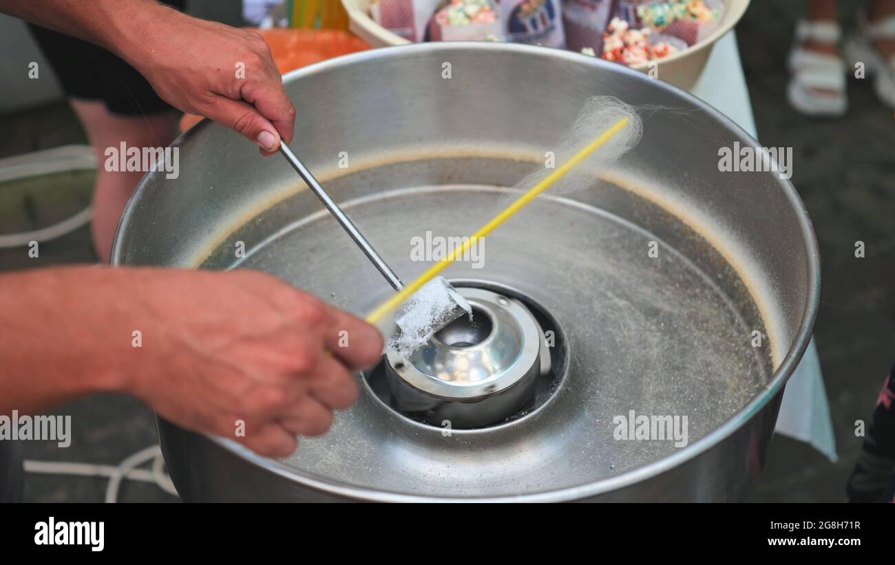 The process of making cotton candy on the street Stock Photo - Alamy