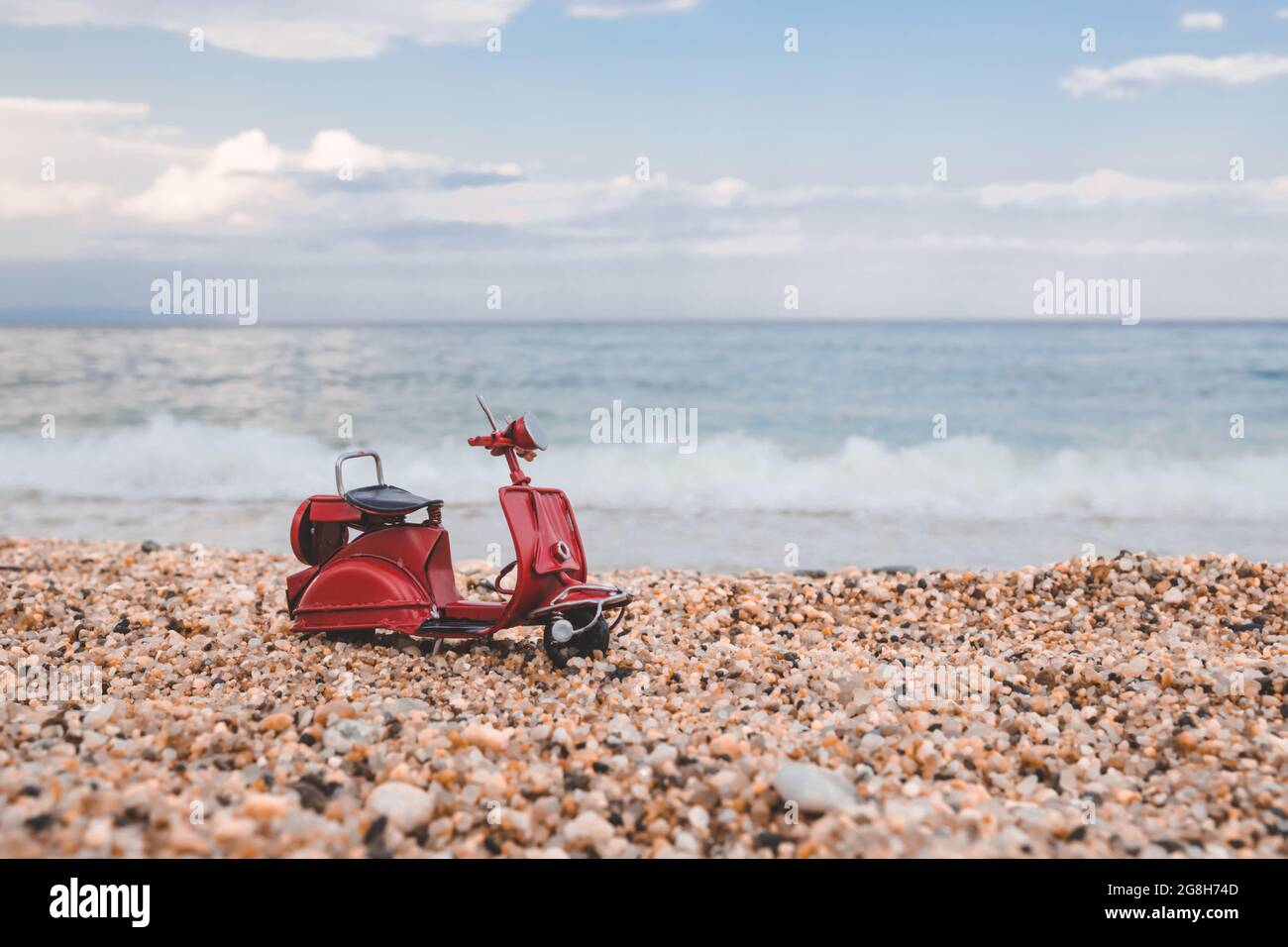Vintage miniature motorcycle on summer background. Vacation, trip ...