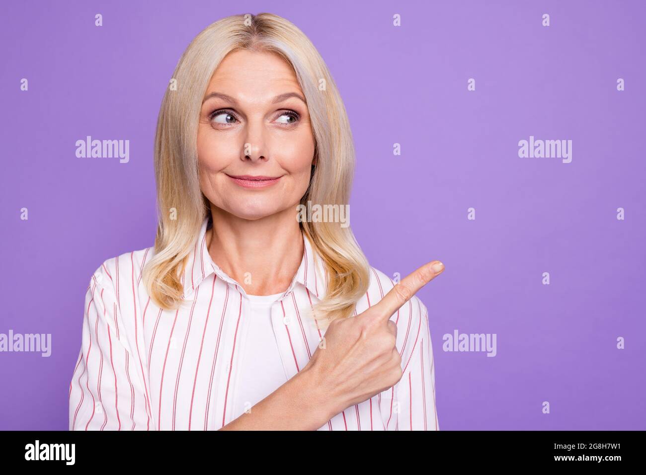 Photo of shiny adorable lady pensioner wear striped shirt looking ...