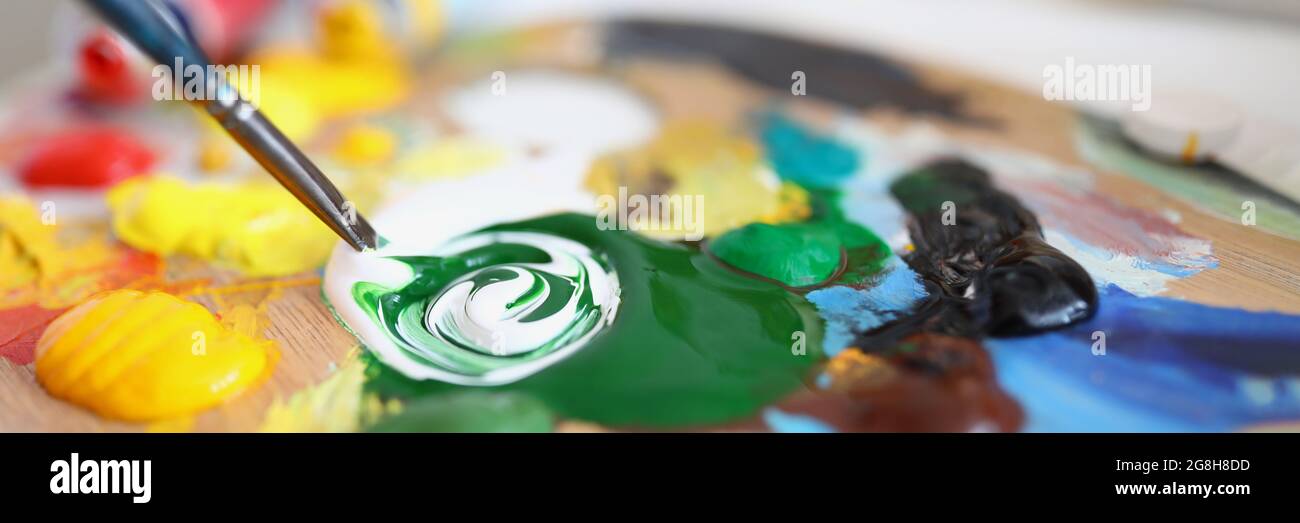The palette contains a mixture paints for painting Stock Photo - Alamy