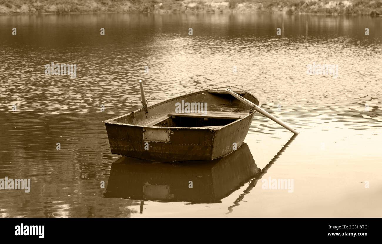 Empty lifeboat, rescue people in the middle of the lake, black and ...