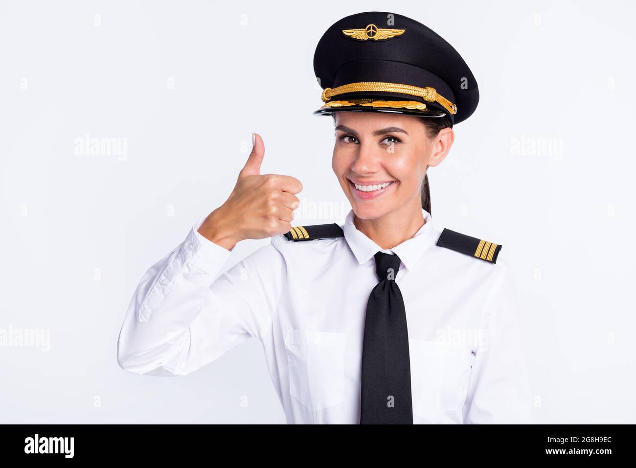Photo of promoter pilot lady raise thumb up wear hat aviator uniform ...