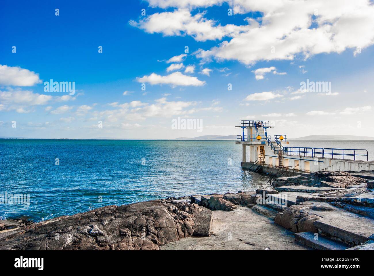 The coast in Salthill overlooking Galway Bay, Ireland, along the Promenade in a sunny bright day ...