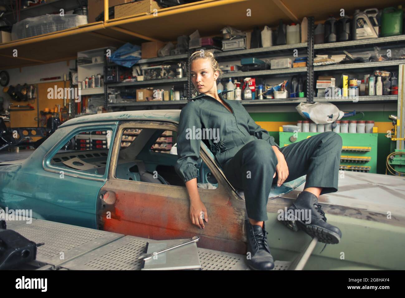 Female mechanician working in the garage Stock Photo - Alamy