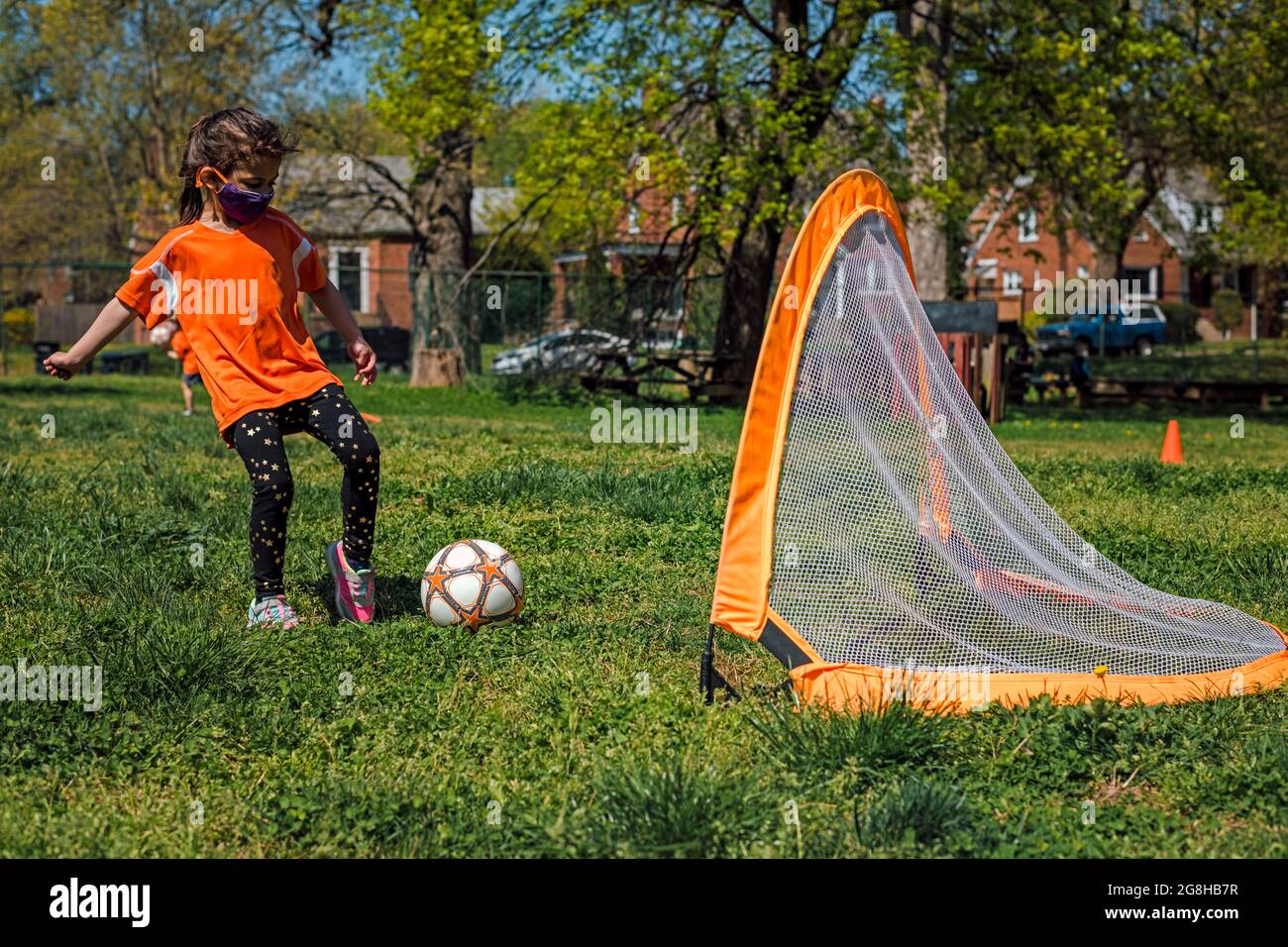 Little girl scoring soccer goal Stock Photo - Alamy