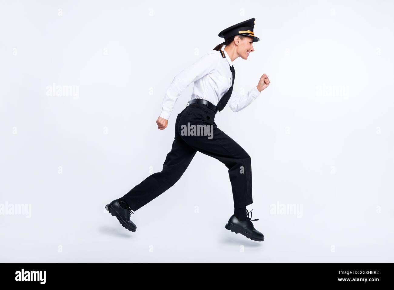 Full length body size profile side view of attractive cheerful pilot ...