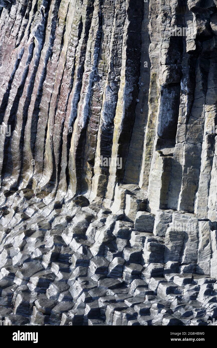basalt columns on the cliffs of the village of Arnastapi Stock Photo ...