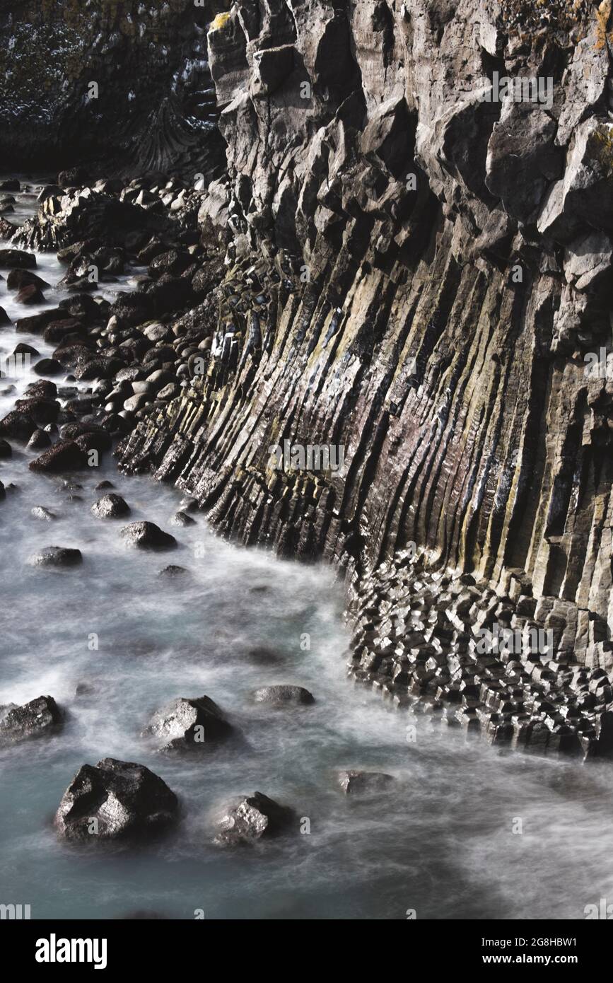 basalt columns on the cliffs of the village of Arnastapi Stock Photo ...