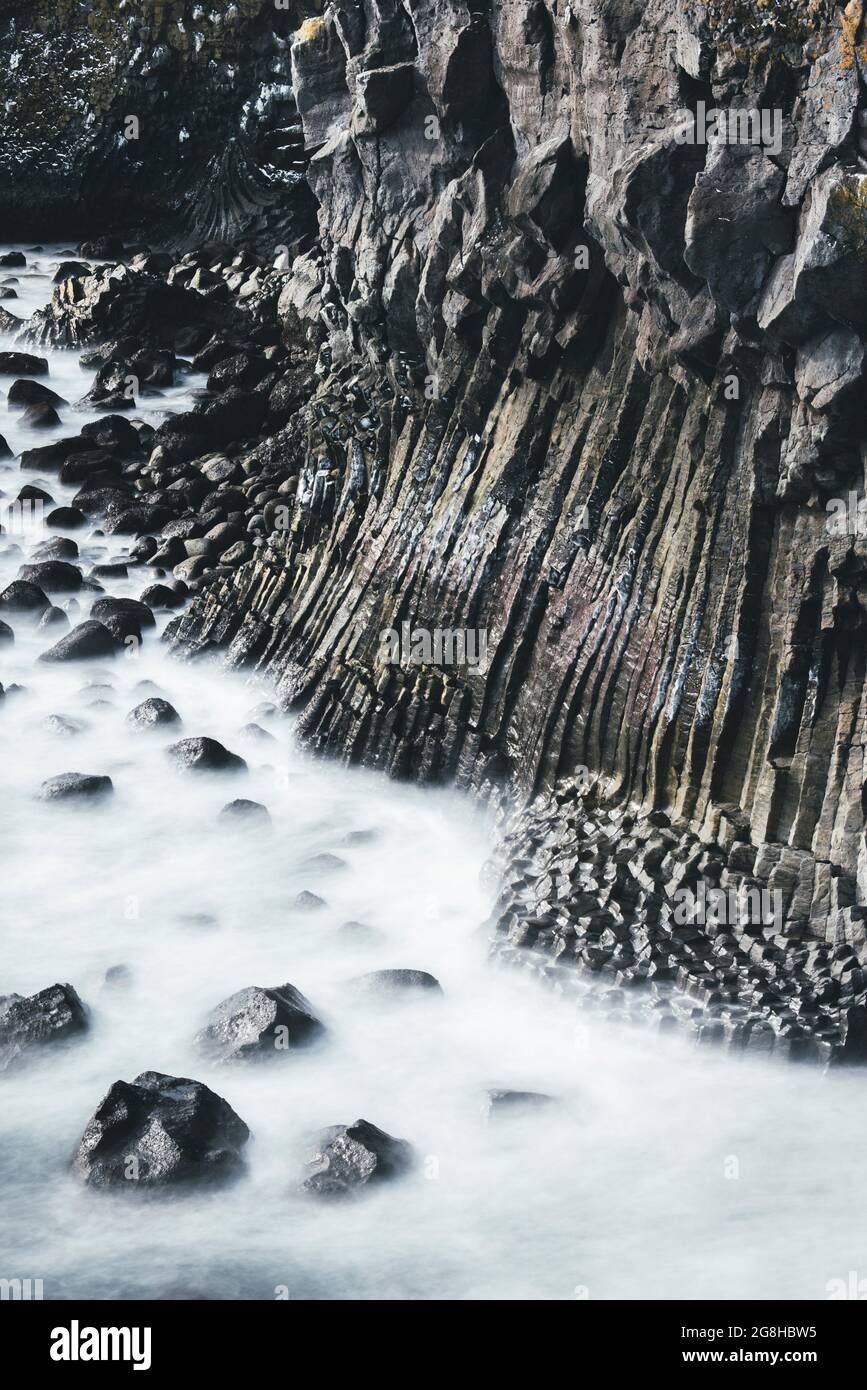 basalt columns on the cliffs of the village of Arnastapi Stock Photo ...