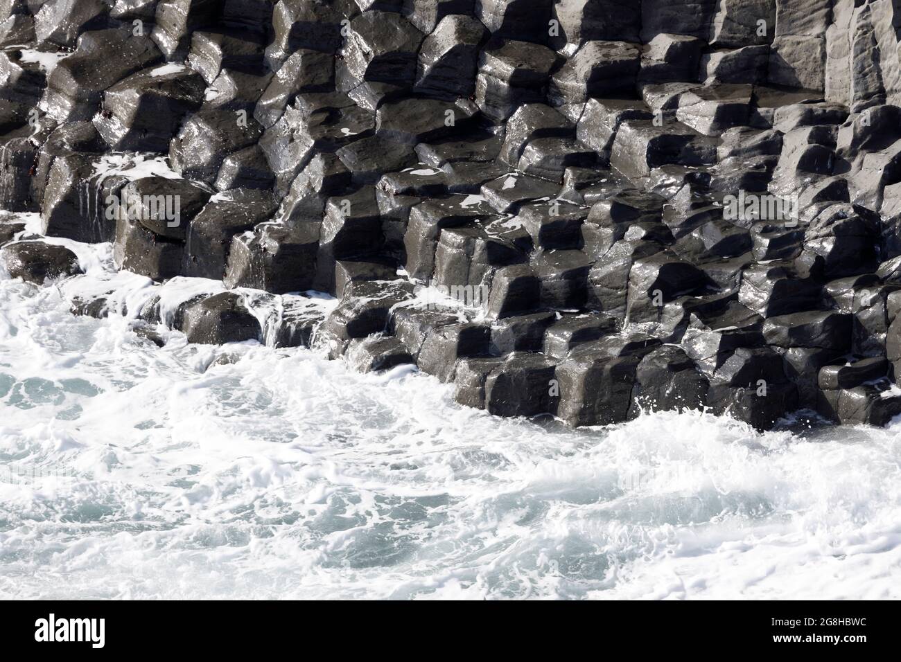basalt columns on the cliffs of the village of Arnastapi Stock Photo ...