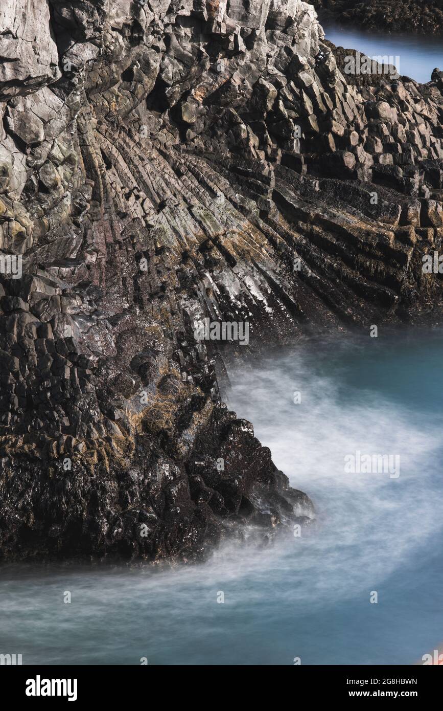 basalt columns on the cliffs of the village of Arnastapi Stock Photo ...