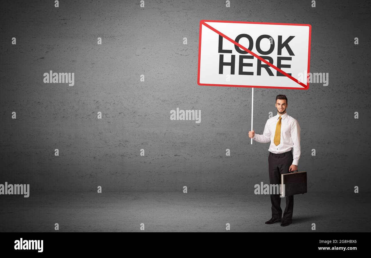 business person holding a traffic sign Stock Photo - Alamy