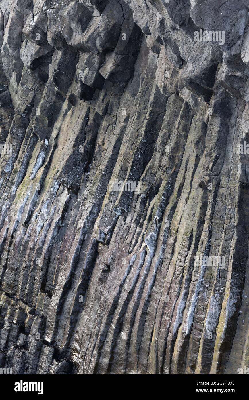 basalt columns on the cliffs of the village of Arnastapi Stock Photo ...