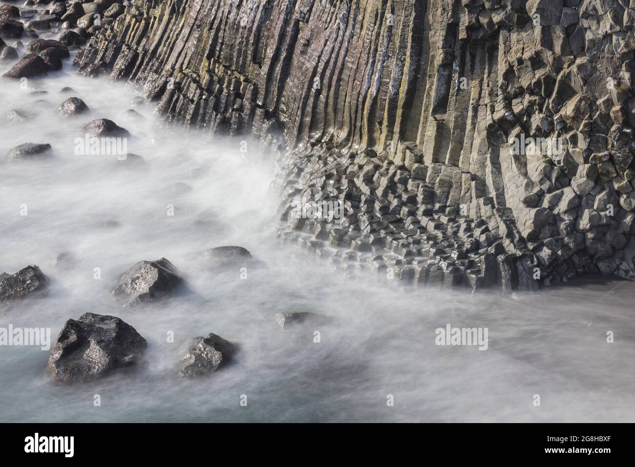 basalt columns on the cliffs of the village of Arnastapi Stock Photo ...