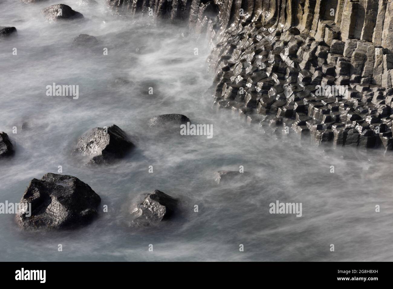 basalt columns on the cliffs of the village of Arnastapi Stock Photo ...