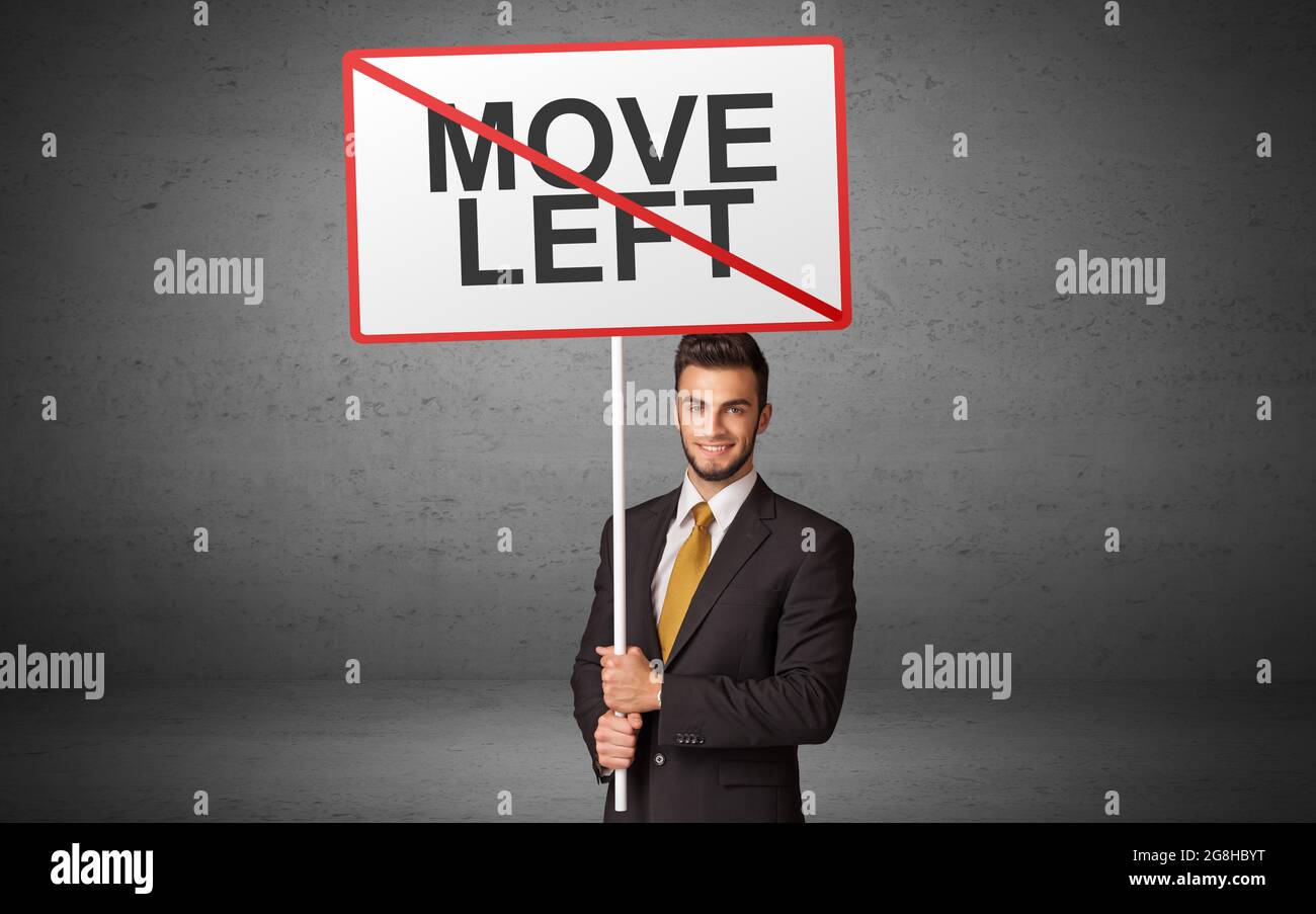 business person holding a traffic sign Stock Photo - Alamy