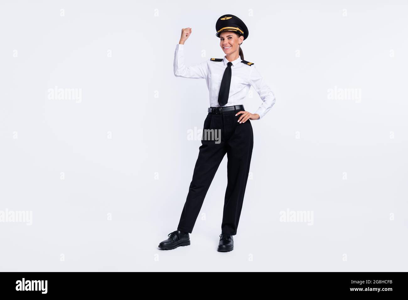Full length body size view of attractive cheerful pilot girl ...