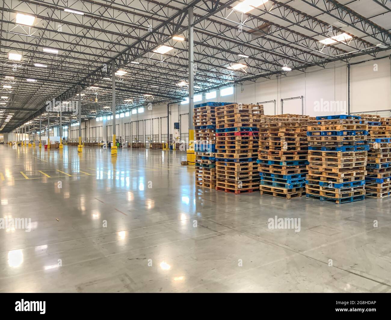 Massive Empty Industrial Warehouse Interior With Stacked Pallets Stock ...