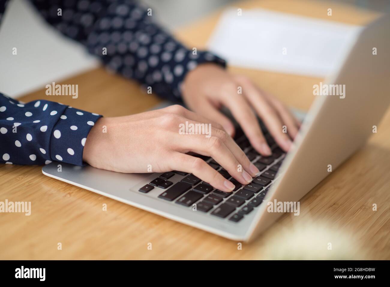 Cropped close-up view of hands girl expert specialist typing text on ...