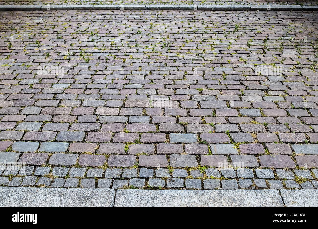 Close up view on old historical cobblestone roads and walkways all over ...