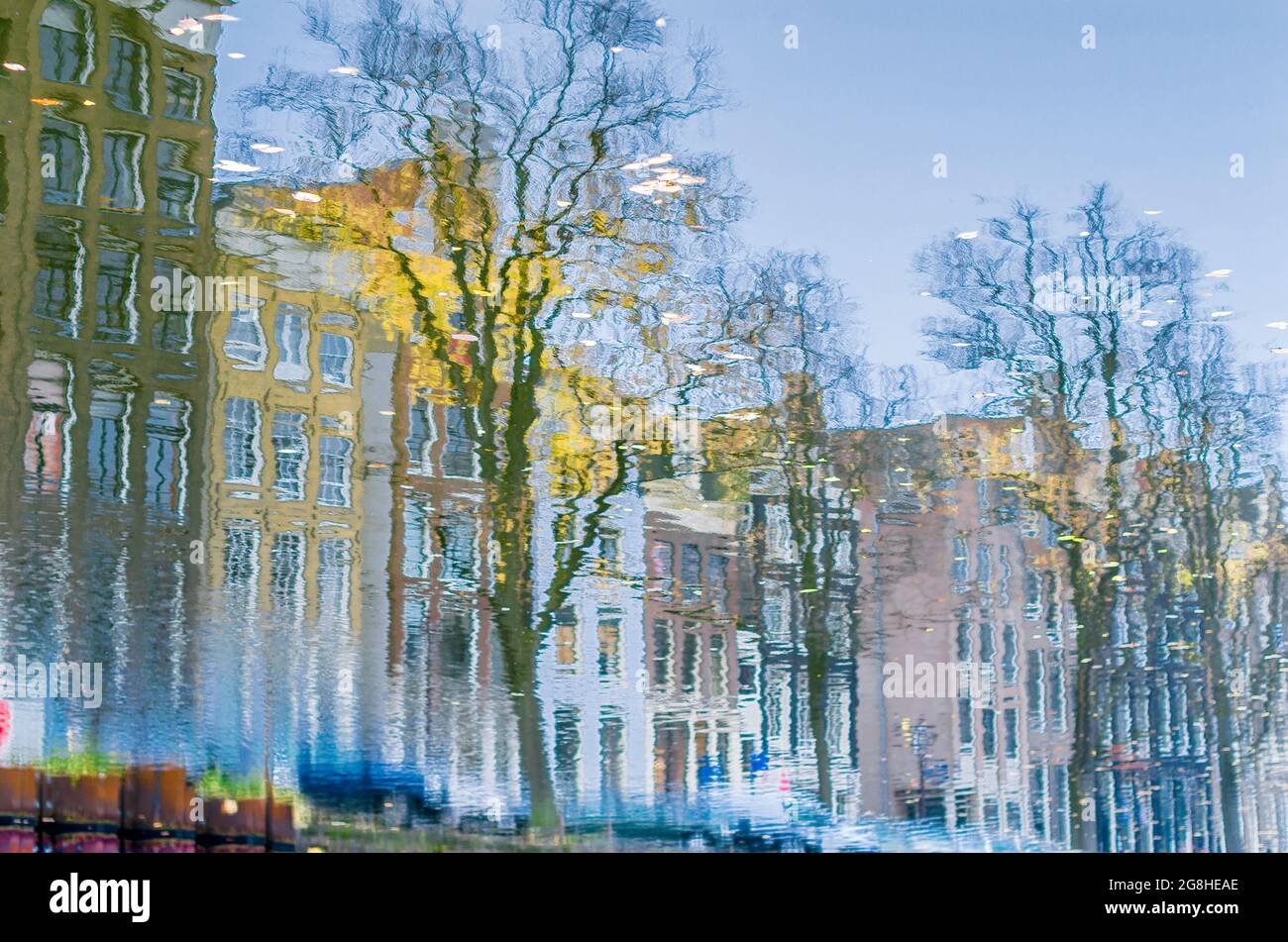 Vibrant reflection of the colorful buildings along the canal in ...
