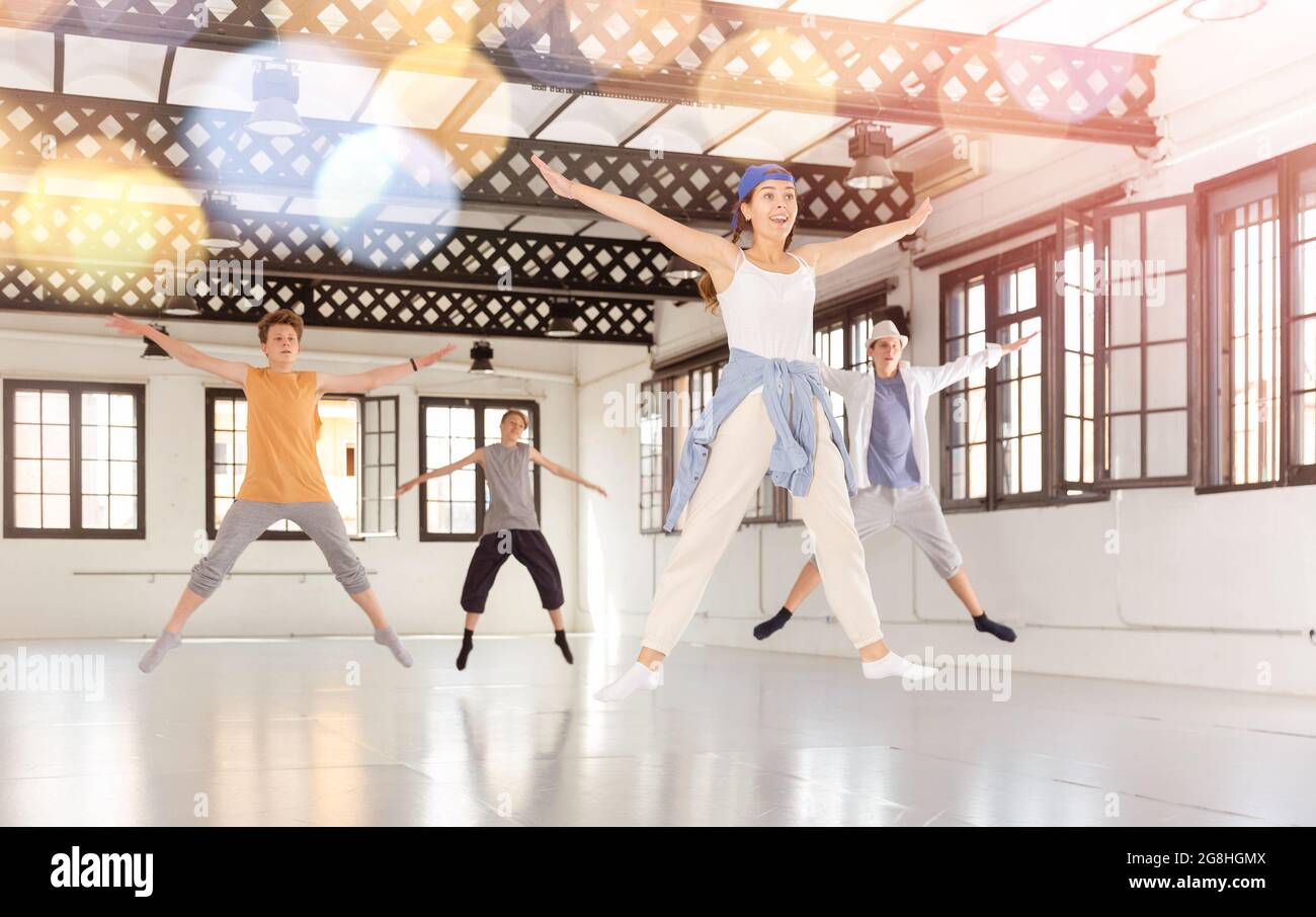 Teenage dancers jumping together during workout Stock Photo - Alamy