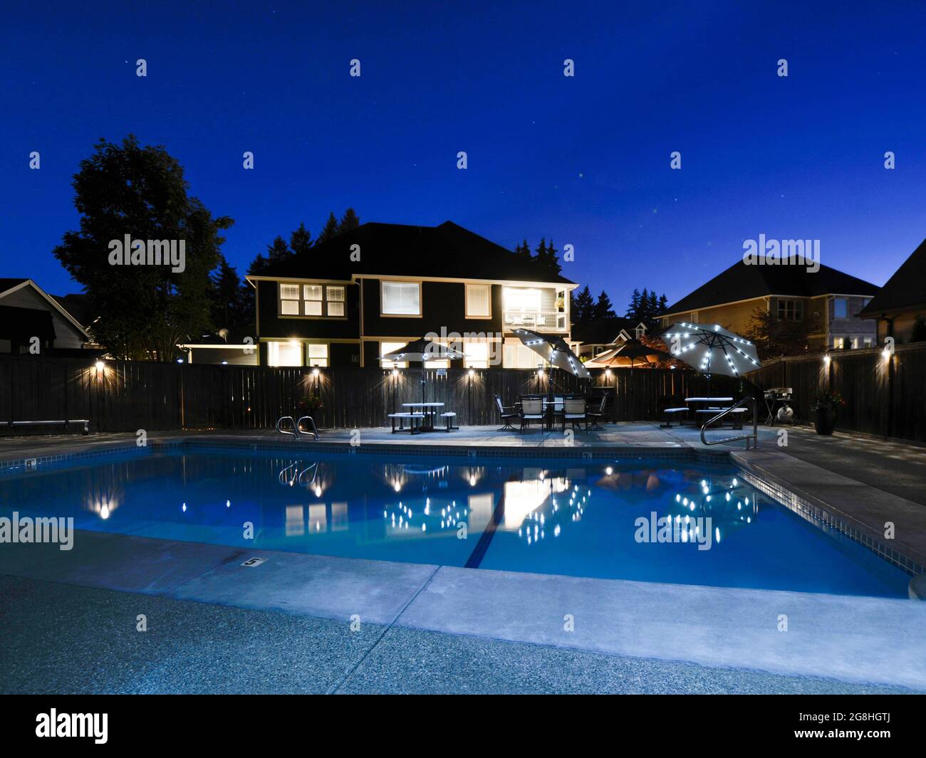 Luxury home exterior at night Stock Photo - Alamy