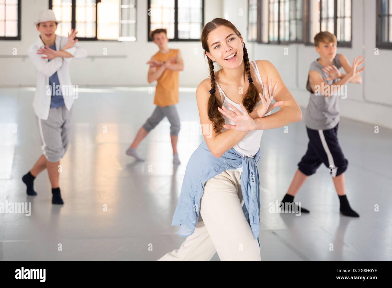 Teenage girl practicing active dance at studio Stock Photo - Alamy