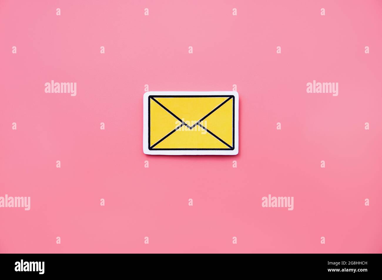 Yellow message sign or envelope icon against a pink background Stock ...