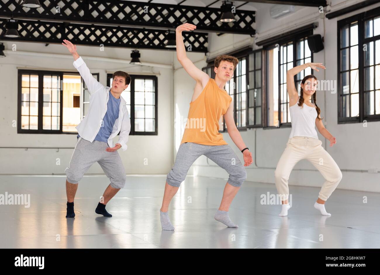 Team of young dancers training moves Stock Photo - Alamy