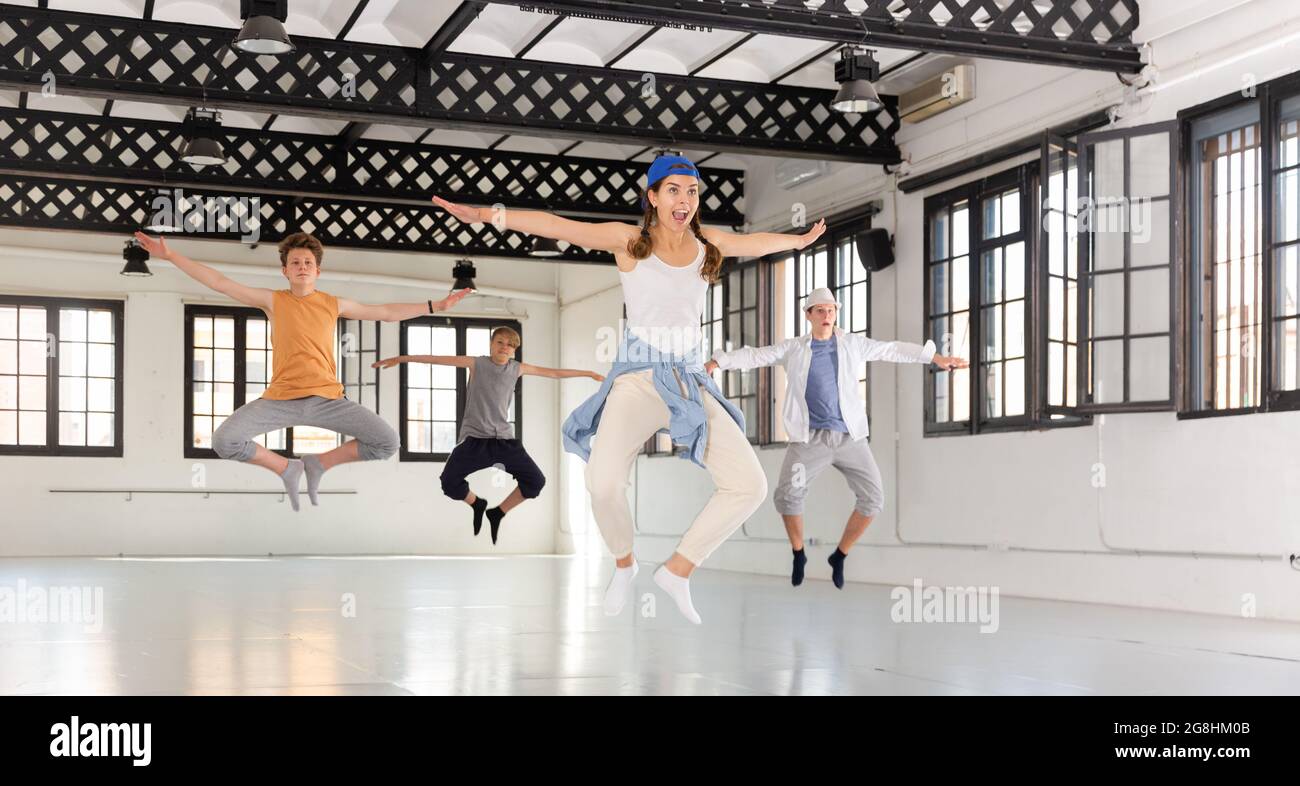 Teenage dancers jumping together during workout Stock Photo - Alamy